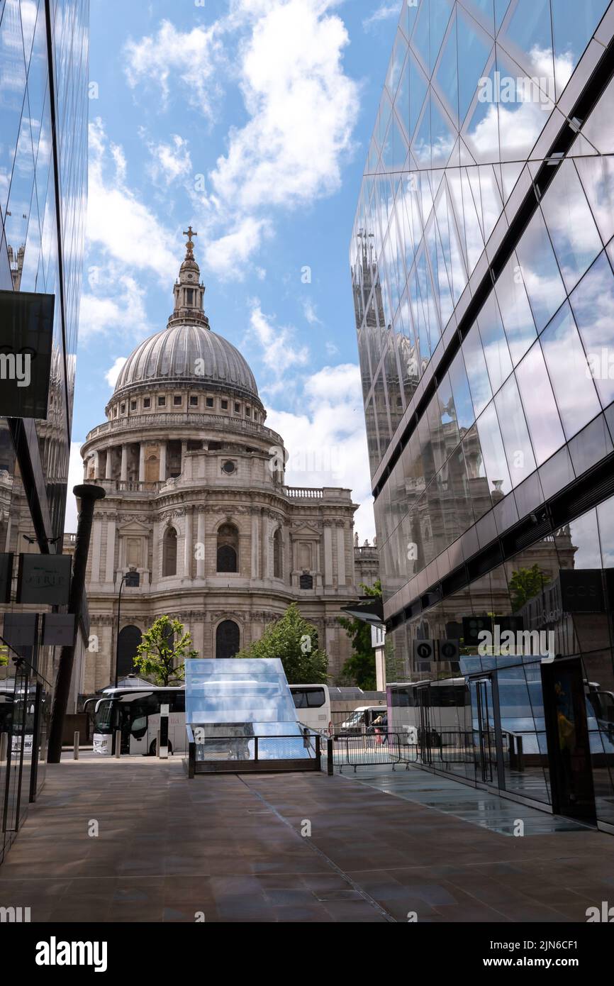 St.Paul`s Cathedral with reflections on glass building, taken 20th May 2022 Stock Photo - Alamy